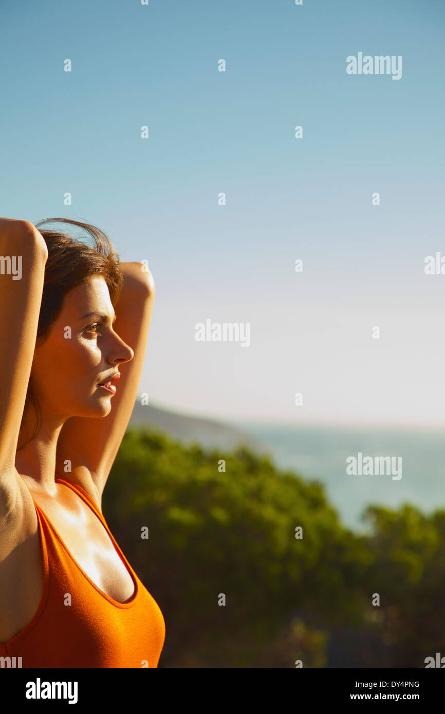 Woman arms behind head hi-res stock photography and images - Alamy