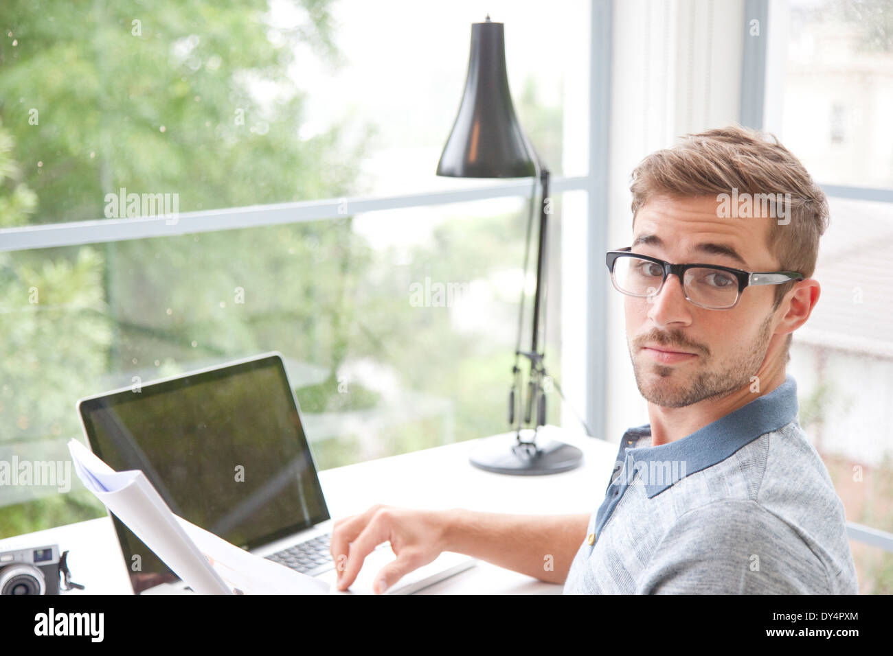 Man wearing sitting in desk hi-res stock photography and images - Alamy