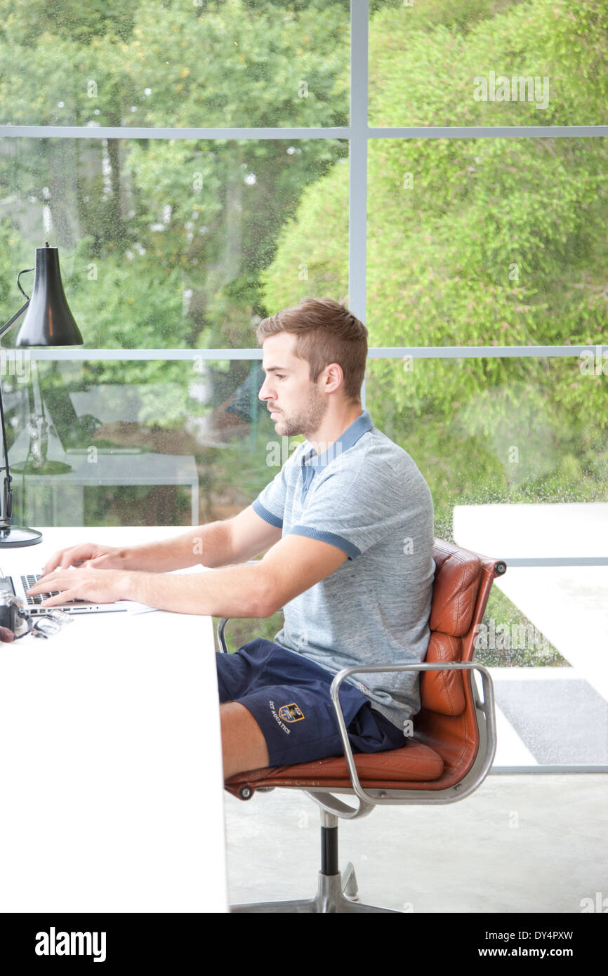 Man Sitting Desk Full View High Resolution Stock Photography and Images ...