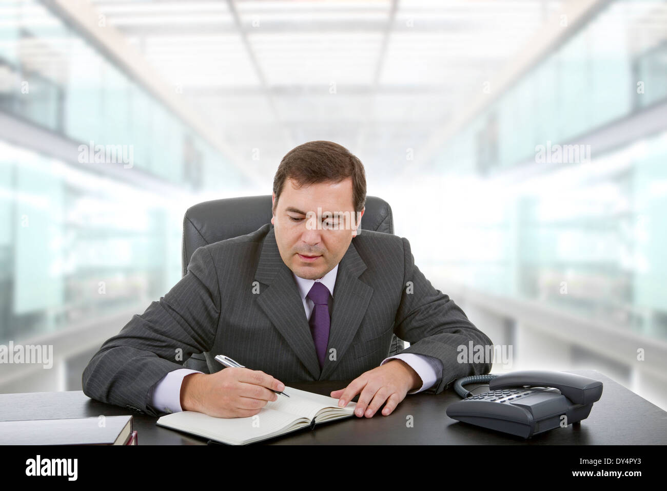 executive at work on his desk at the office Stock Photo - Alamy