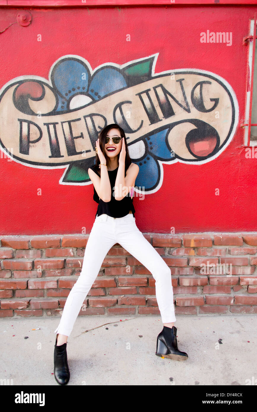 Leaning against graffiti wall hi-res stock photography and images - Alamy