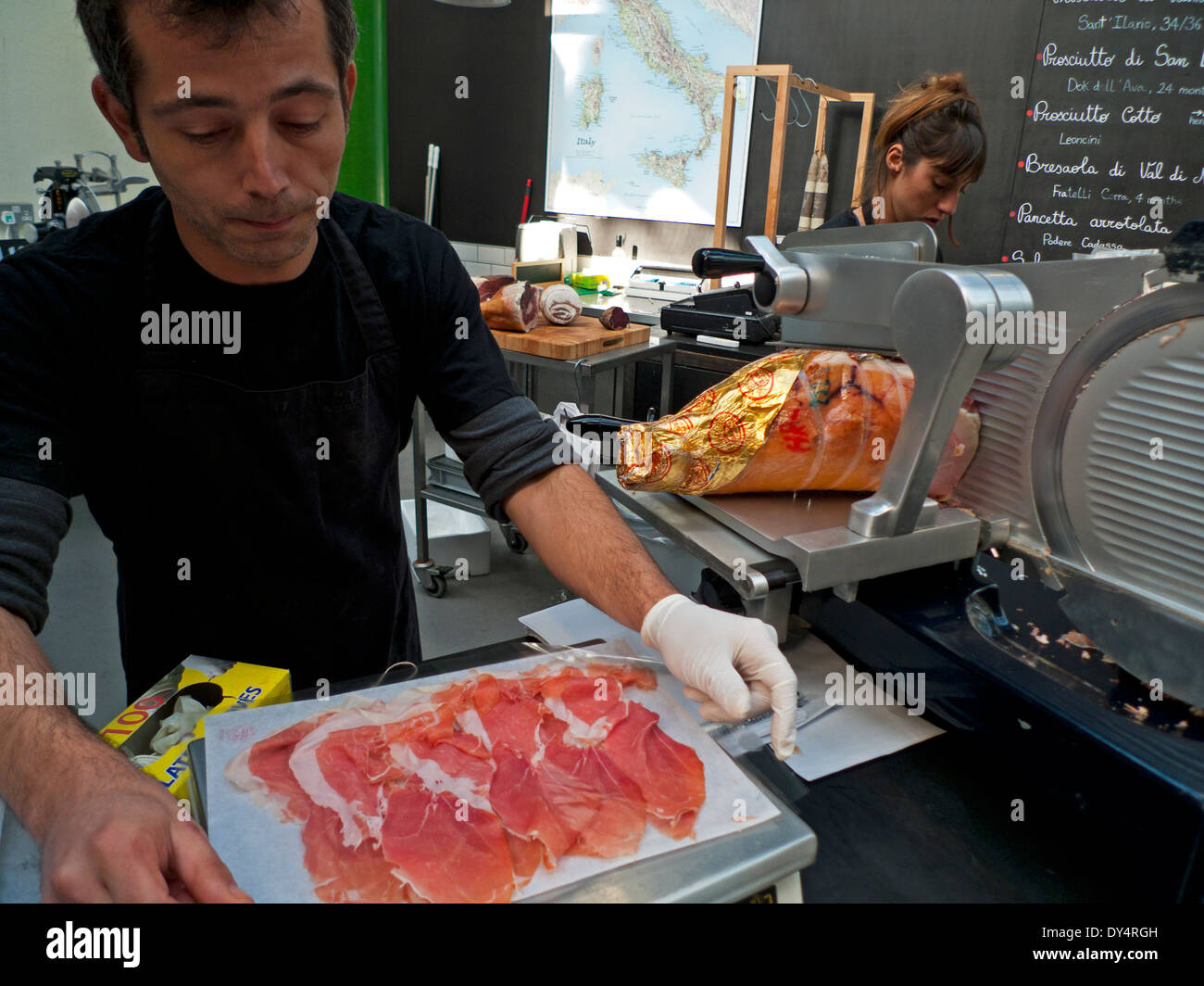 A man holding a tray of parma ham at he Parma Ham & Mozzarella Stand at ...