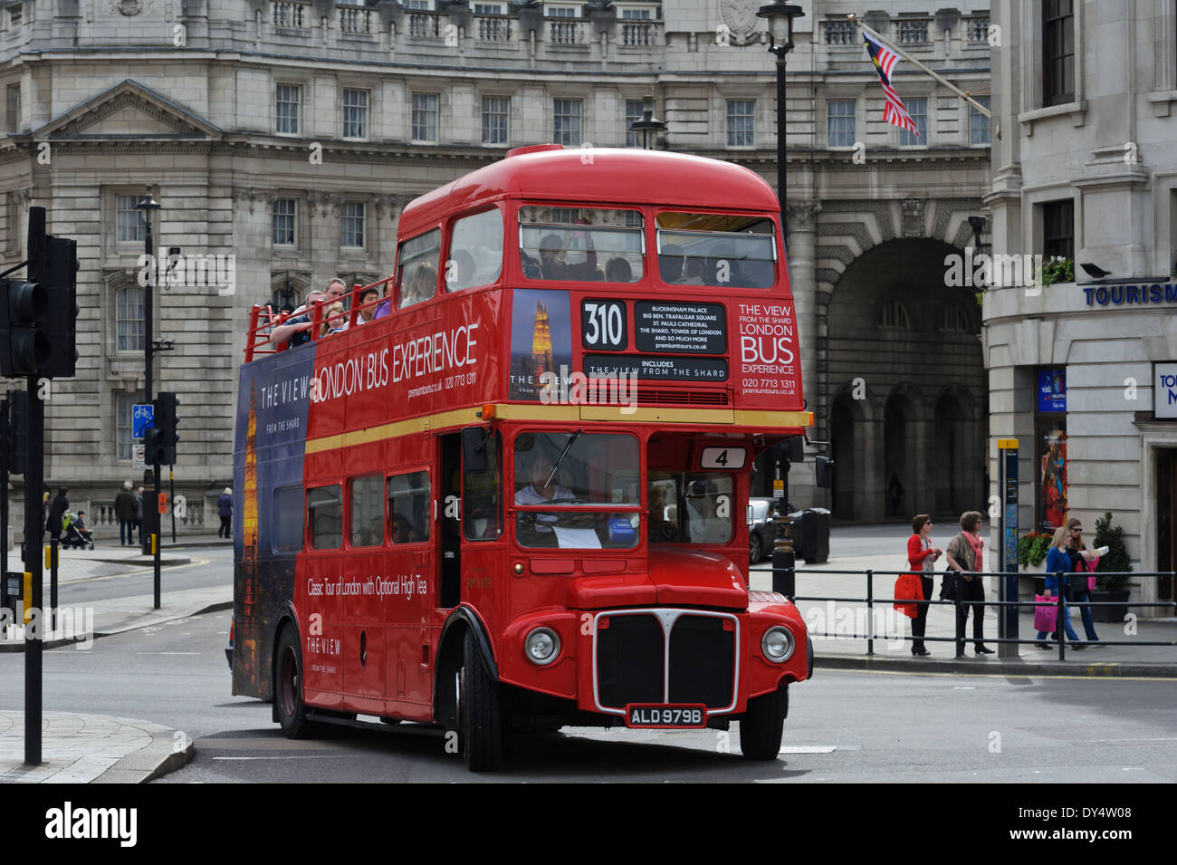 Iconic British red routemaster bus traveling near Trafalgar Square ...