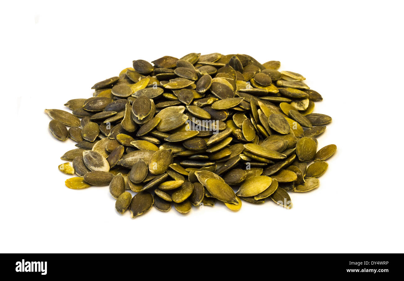 Photo peeled pumpkin seeds, isolated on a white background Stock Photo ...