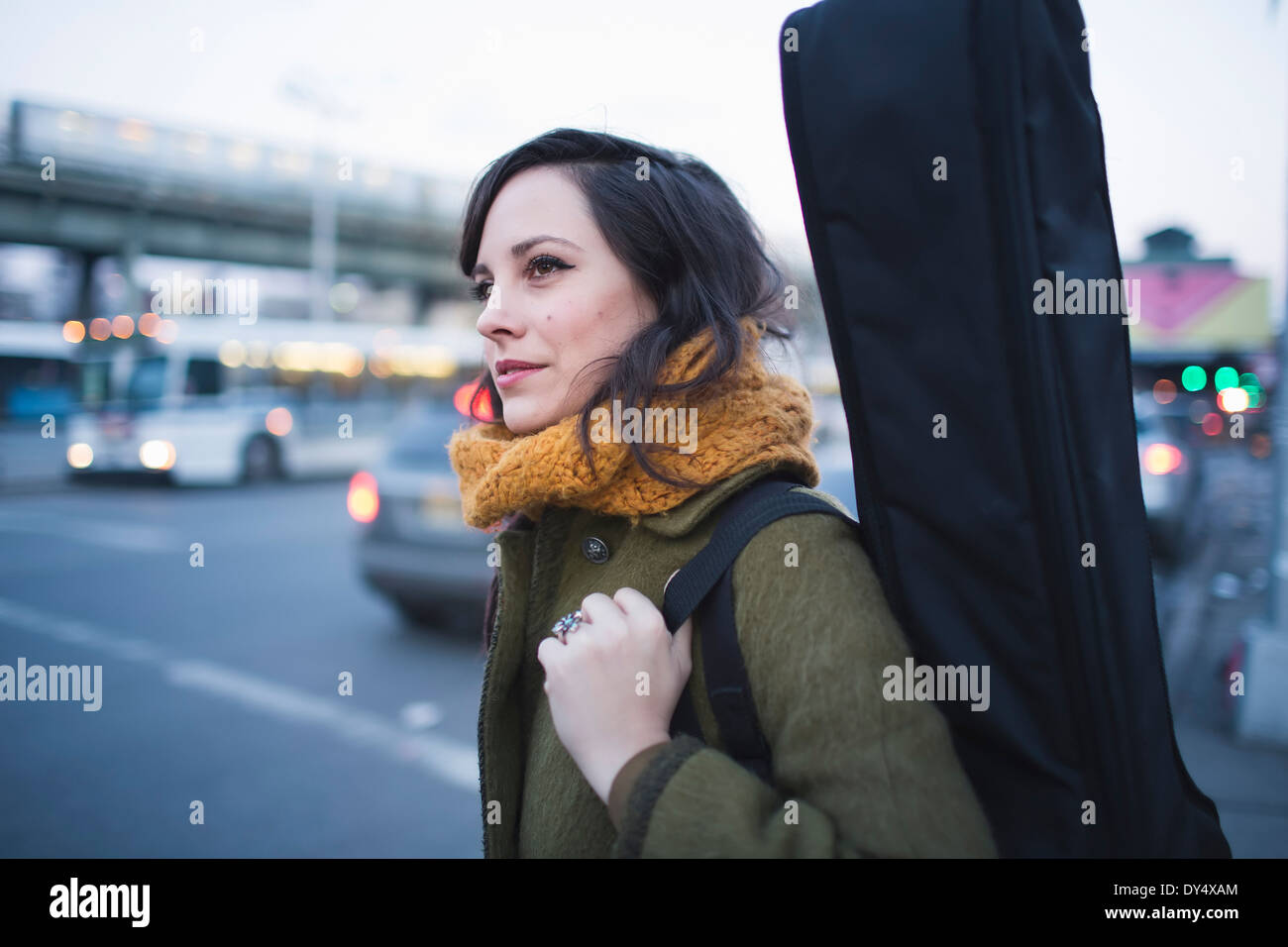 Woman carrying guitar case hi-res stock photography and images - Alamy