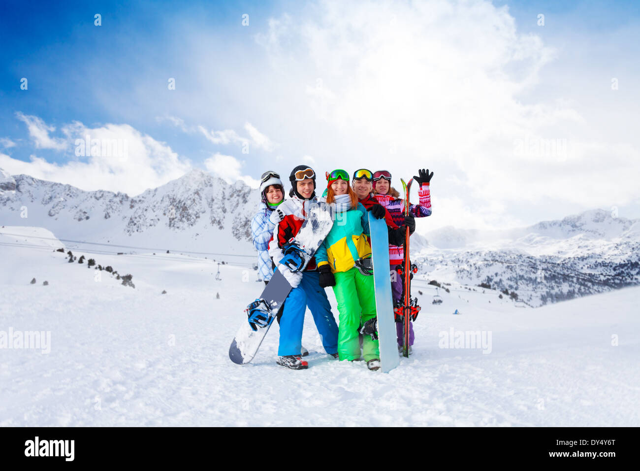 Five friends standing with snowboards Stock Photo - Alamy