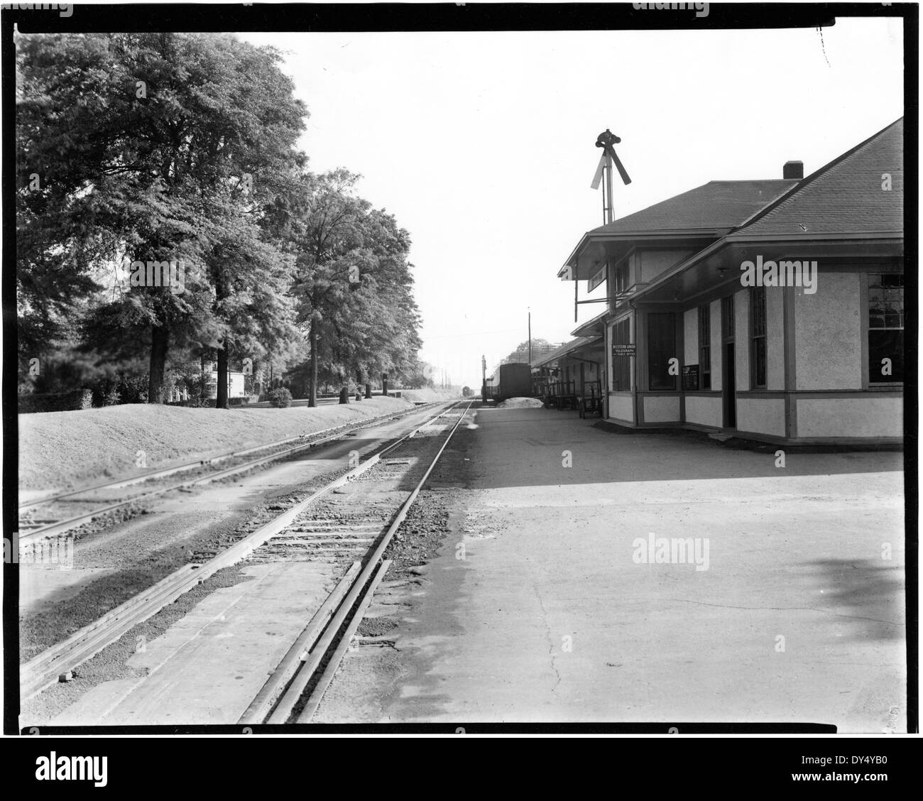 This image shows a railroad depot with visible tracks, emphasizing the ...