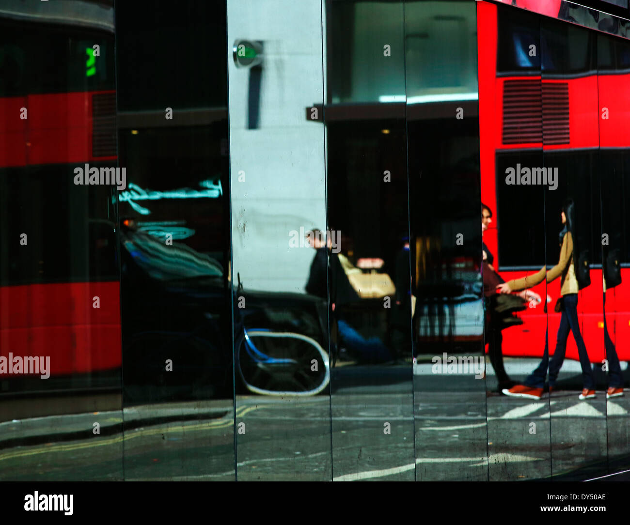 reflection of bus and passers by Stock Photo - Alamy