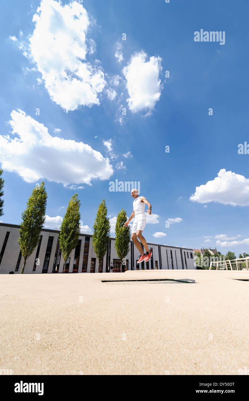 Man jumping in mid air sun hi-res stock photography and images - Alamy
