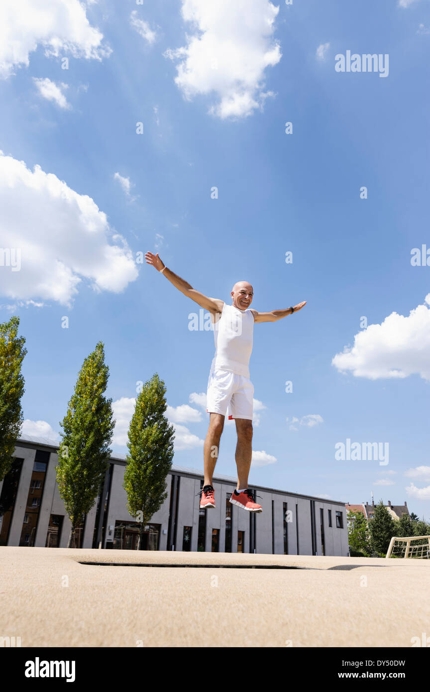 Man jumping in mid air sun hi-res stock photography and images - Alamy