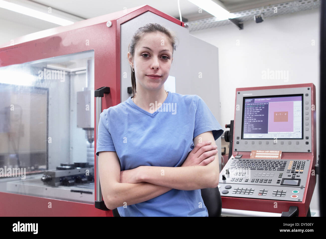 Portrait female warehouse standing arms hi-res stock photography and ...