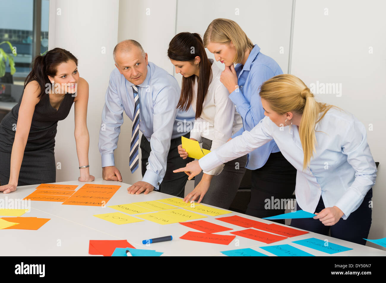 Business team brainstorming discussing working hi-res stock photography ...
