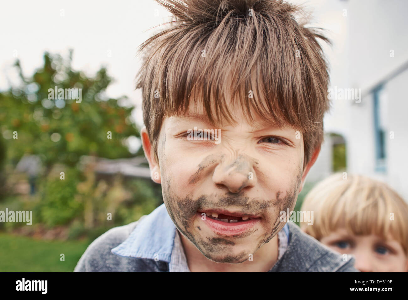 Boy with muddy face Stock Photo - Alamy