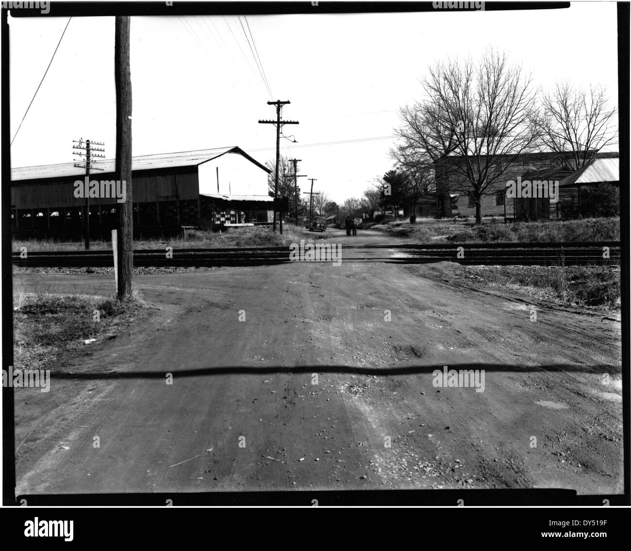 A railroad intersection showing the crossing of two railway tracks, a ...