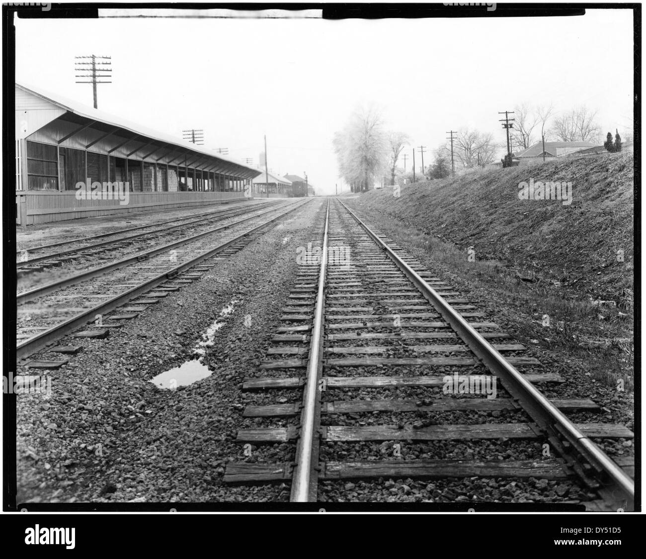 This historical image depicts railroad tracks, an essential feature of ...