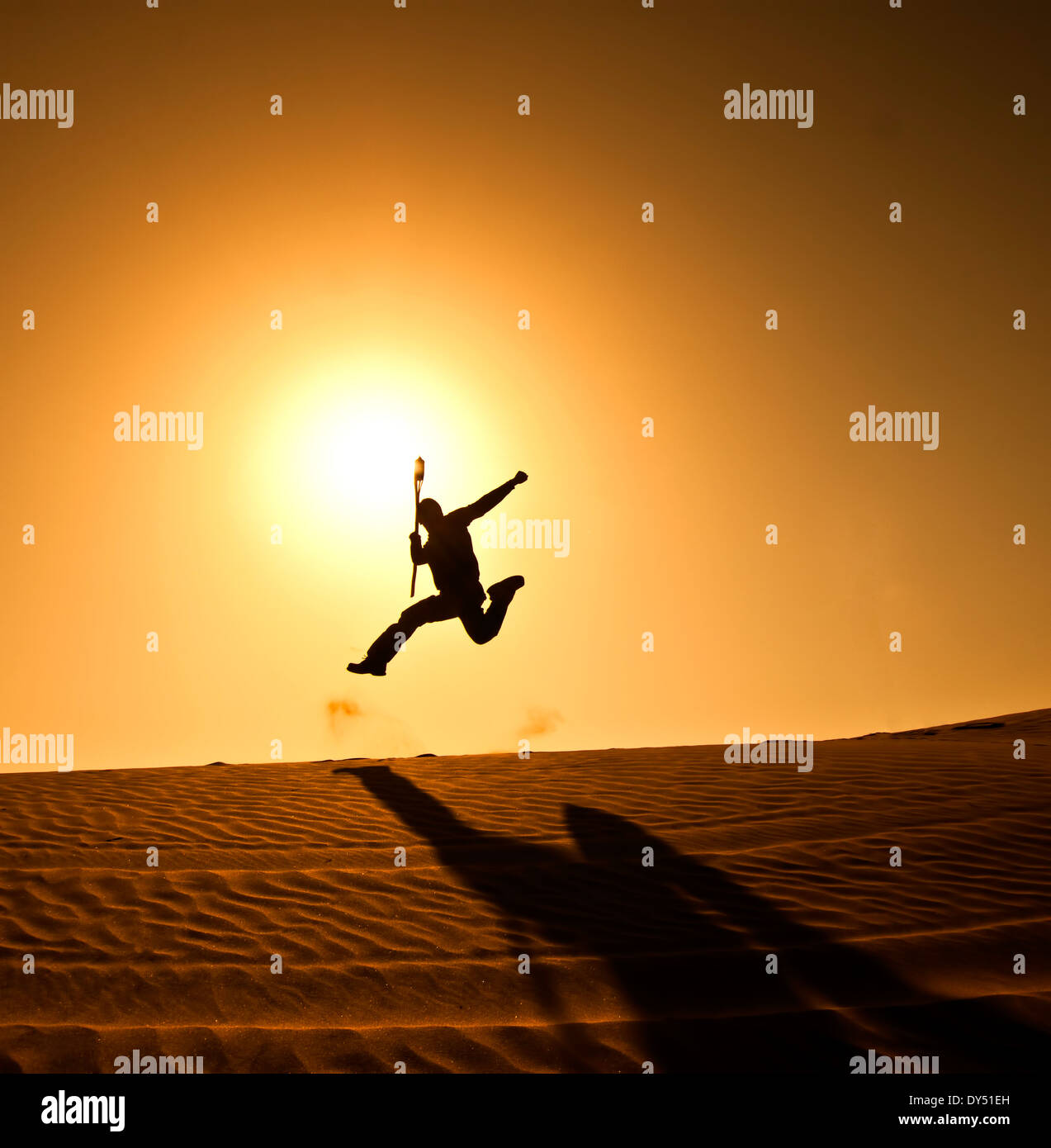 Happy man jumping with arrow in hand, showing success Stock Photo - Alamy