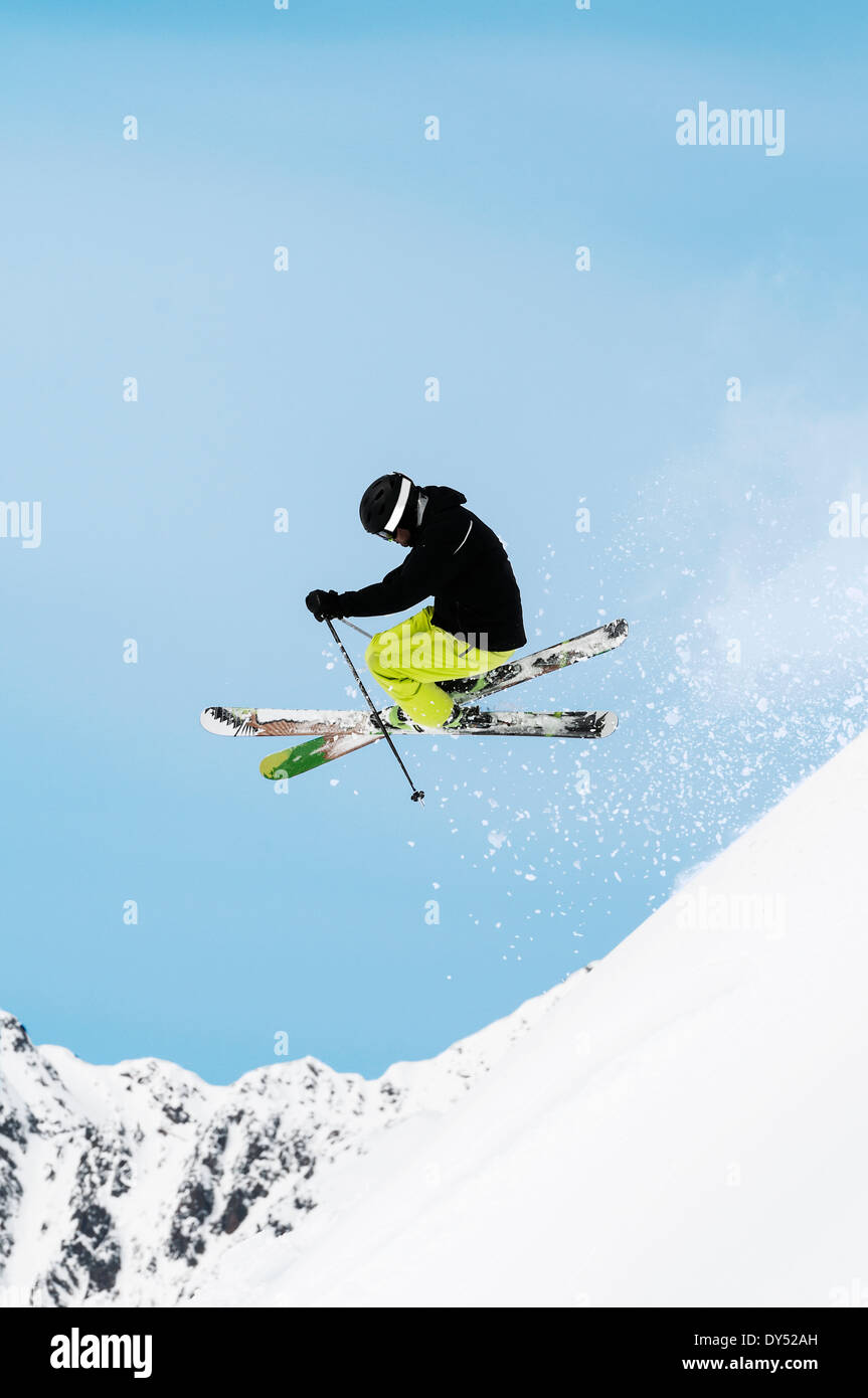 Mid adult male skier mid air, Obergurgl, Austria Stock Photo - Alamy