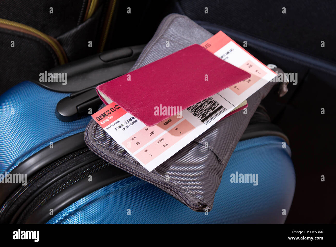 Airline ticket, passport and luggage, ready to travel Stock Photo - Alamy