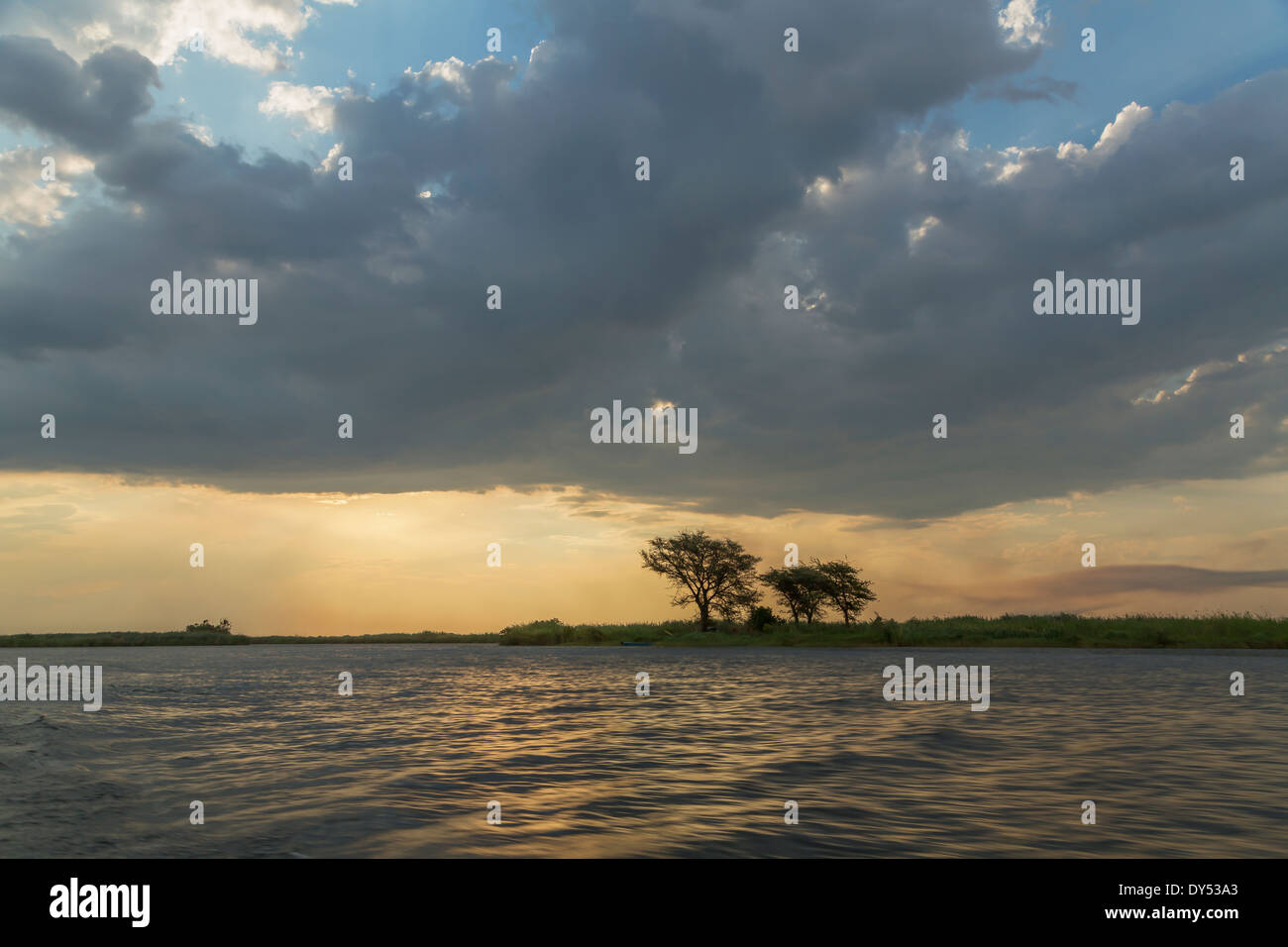 Water and silhouetted trees, Kasane, Chobe National Park, Botswana ...