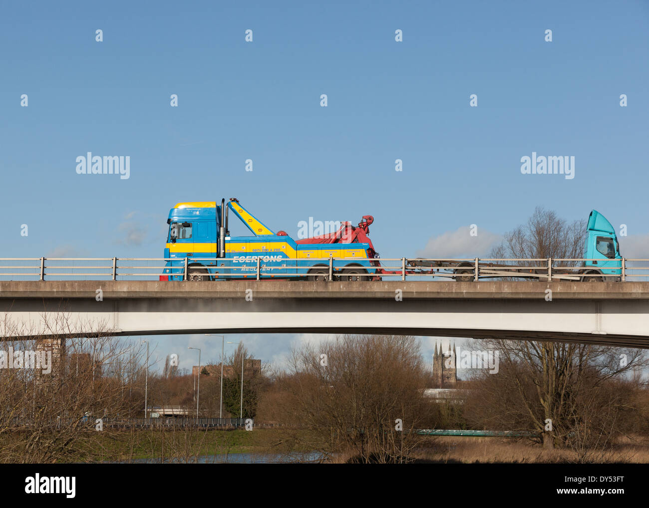 Heavy duty recovery truck towing a broken down lorry Stock Photo - Alamy