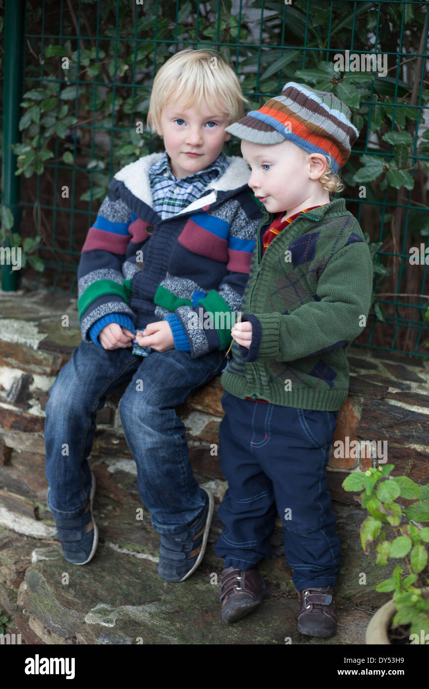 Brothers standing together, outdoors Stock Photo - Alamy