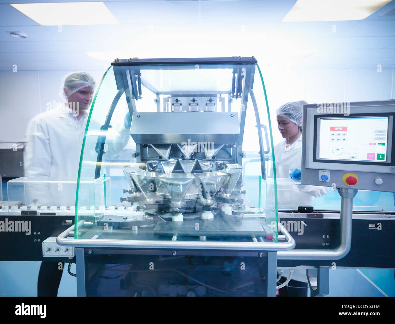Worker inspecting tablets hi-res stock photography and images - Alamy