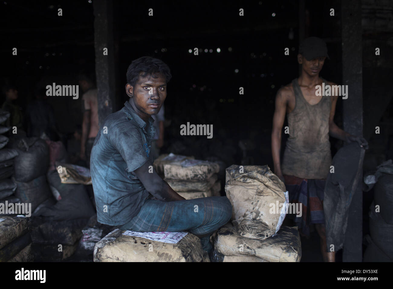 Dhaka, Bangladesh. 7th Apr, 2014. Bangladeshi factory workers work at a ...