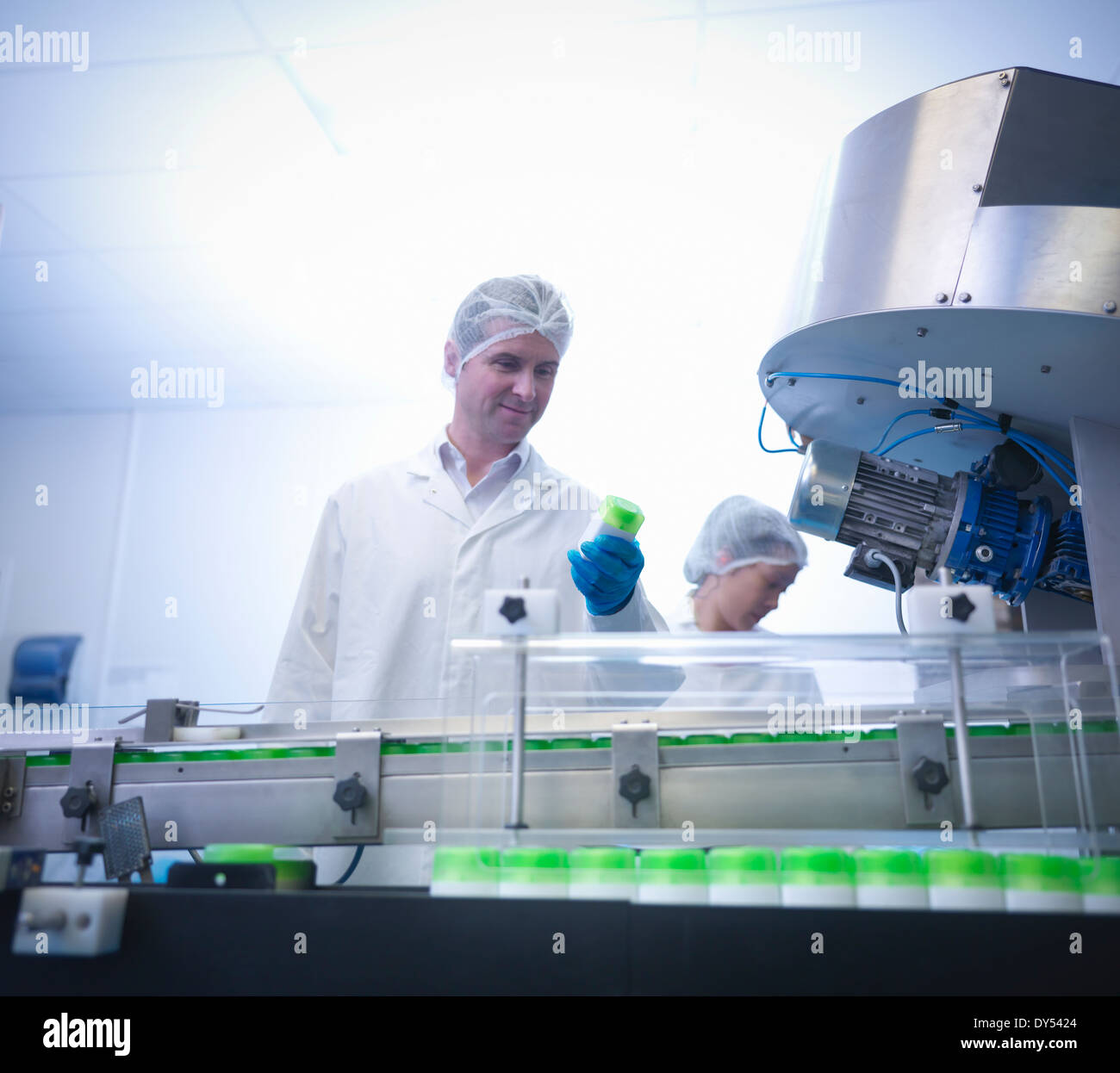 Inspecting products hi-res stock photography and images - Alamy