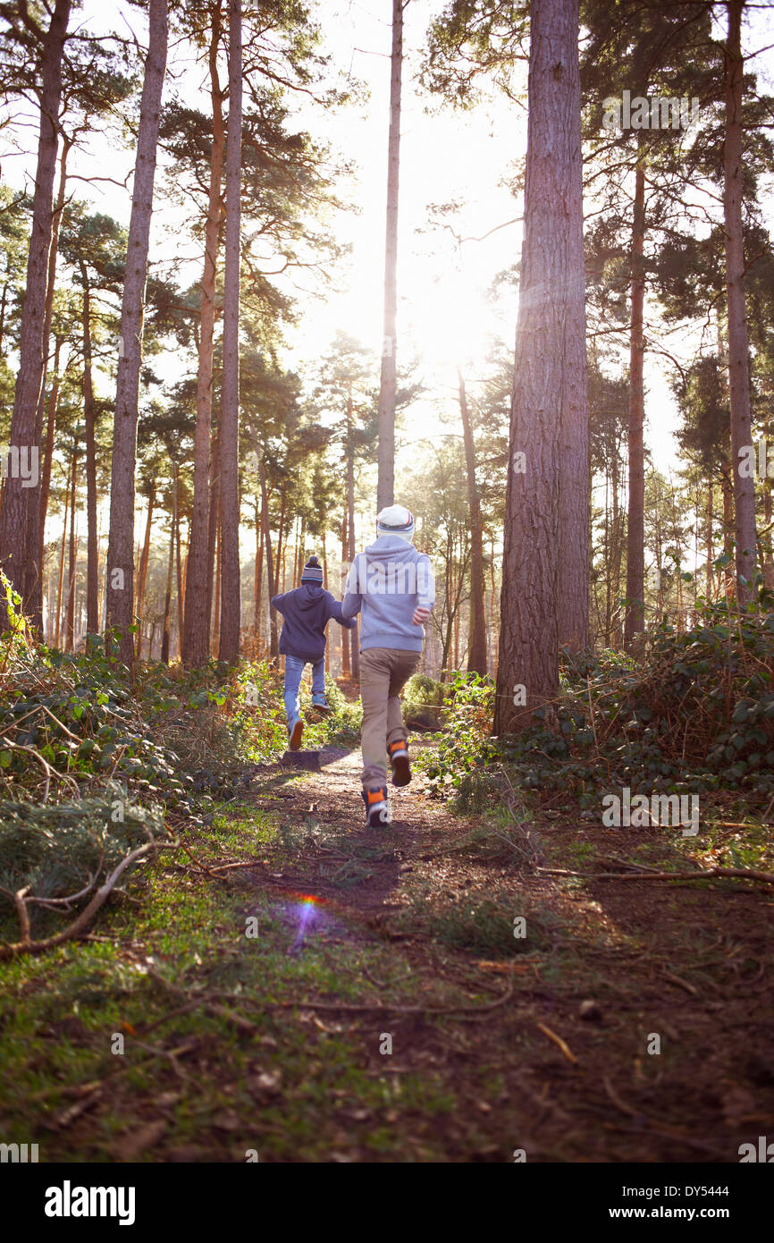 Two boys running forest hi-res stock photography and images - Alamy