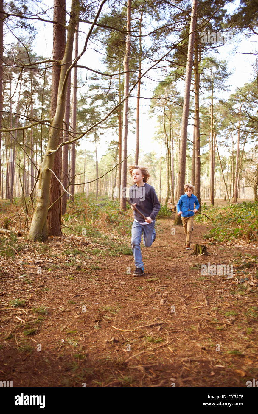 Two boys running forest hi-res stock photography and images - Alamy