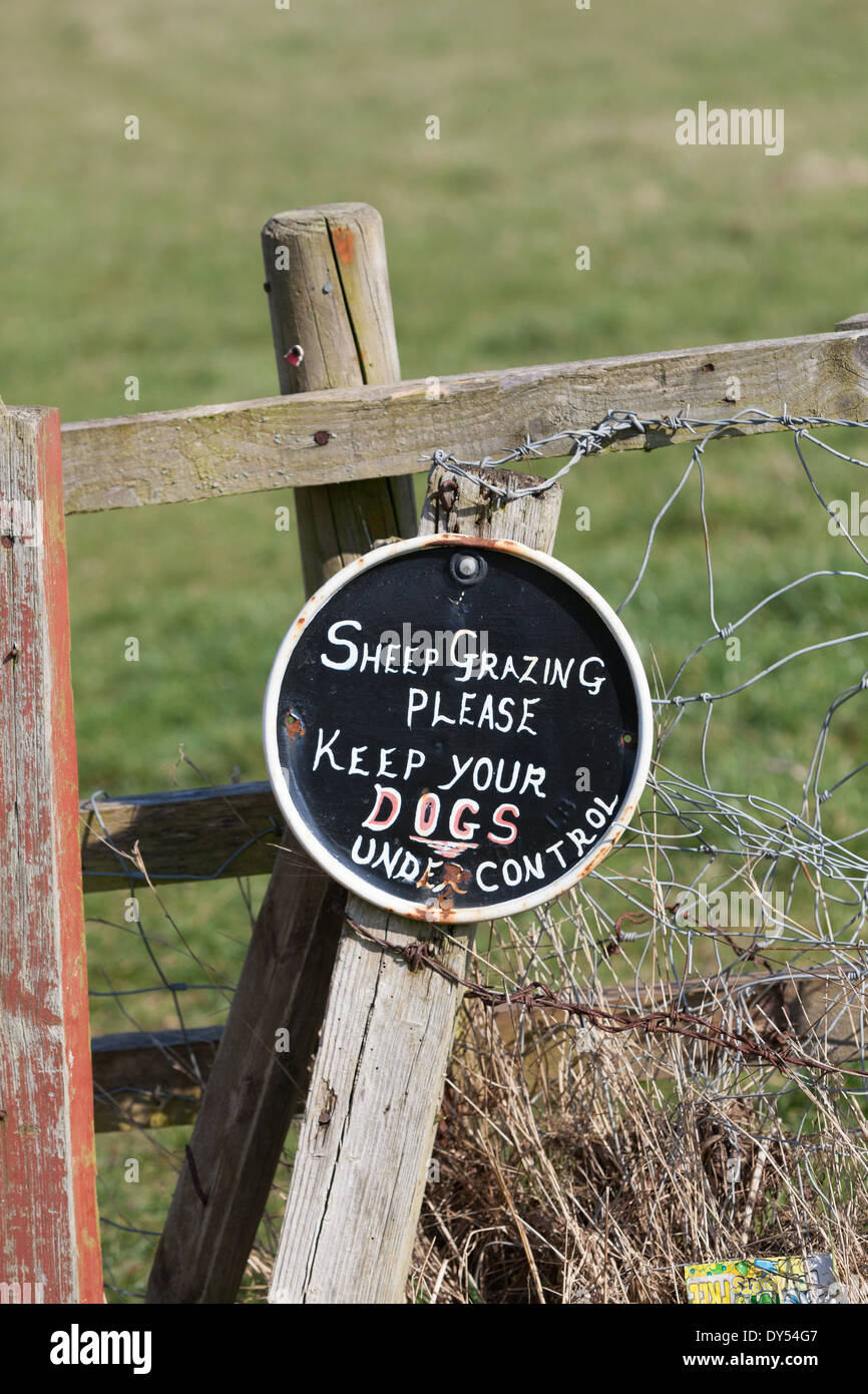 A sign in a field asking owners to keep their dogs under control Stock ...