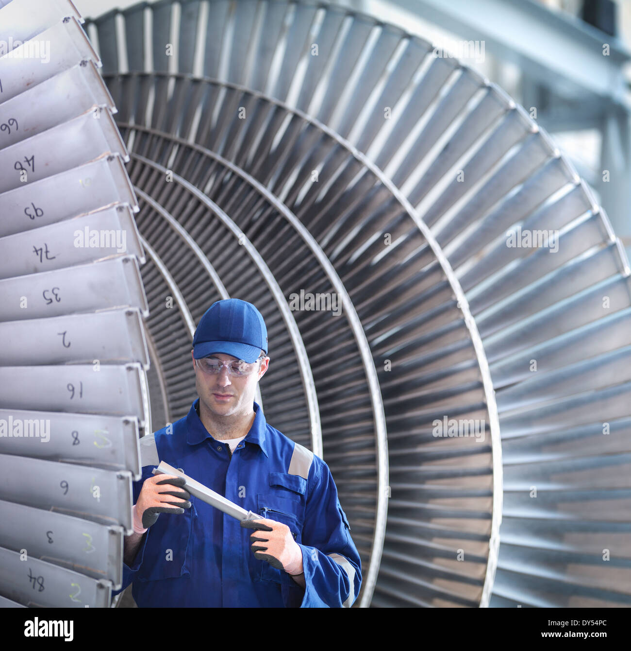 Engineer inspecting turbine in workshop hi-res stock photography and ...