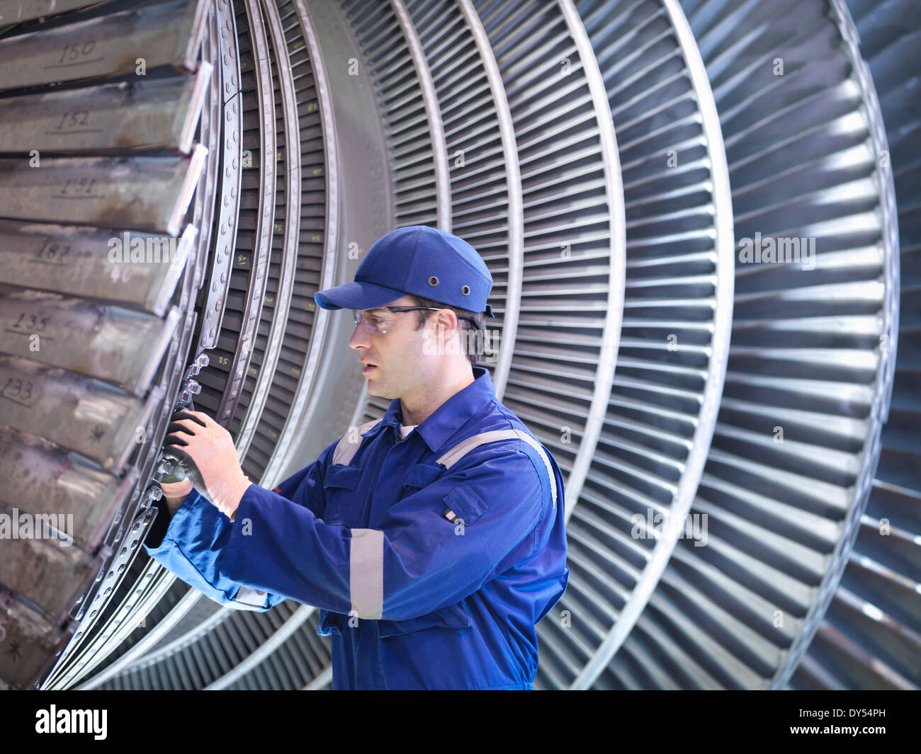 Engineer inspecting turbine in workshop hi-res stock photography and ...