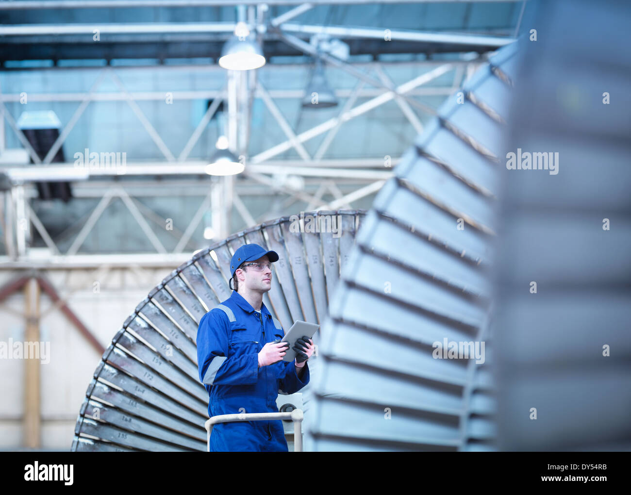 Engineer inspecting turbine in workshop hi-res stock photography and ...