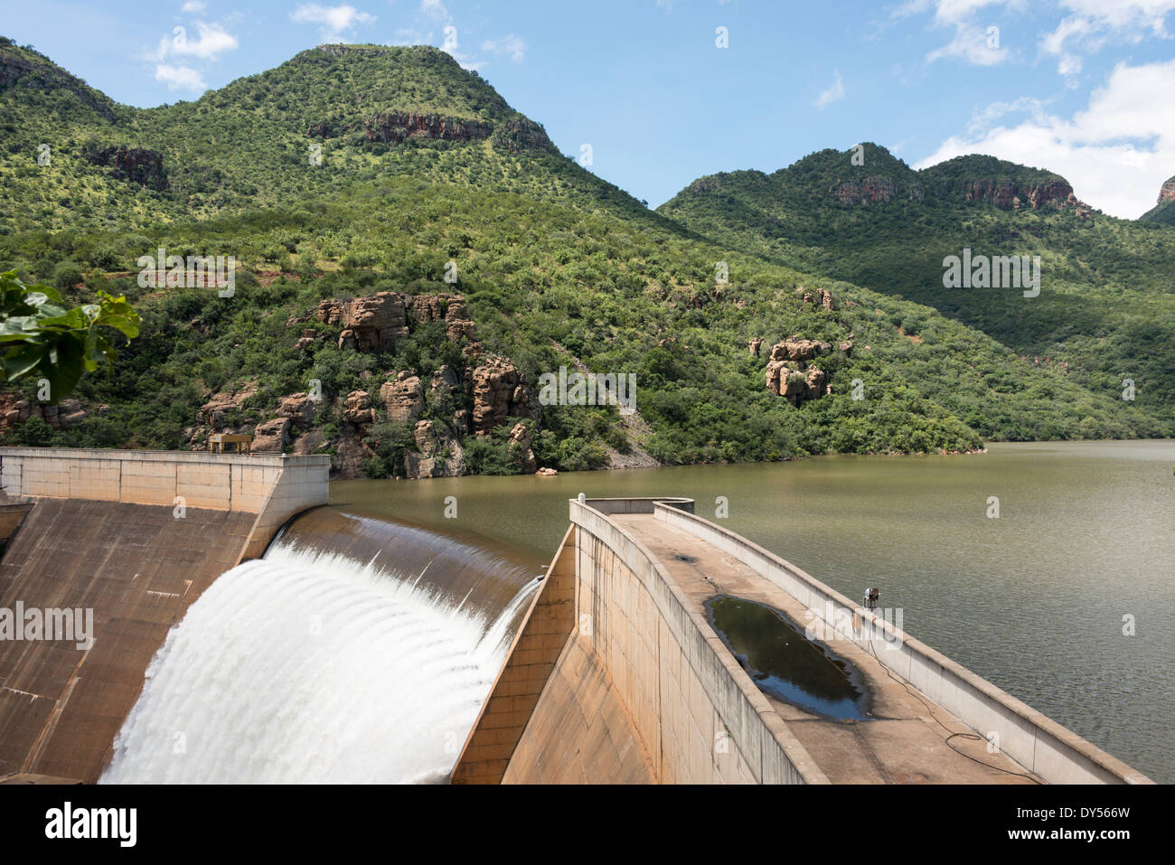 the swadini dam waterfall near the blyde river with the dragensberg as ...