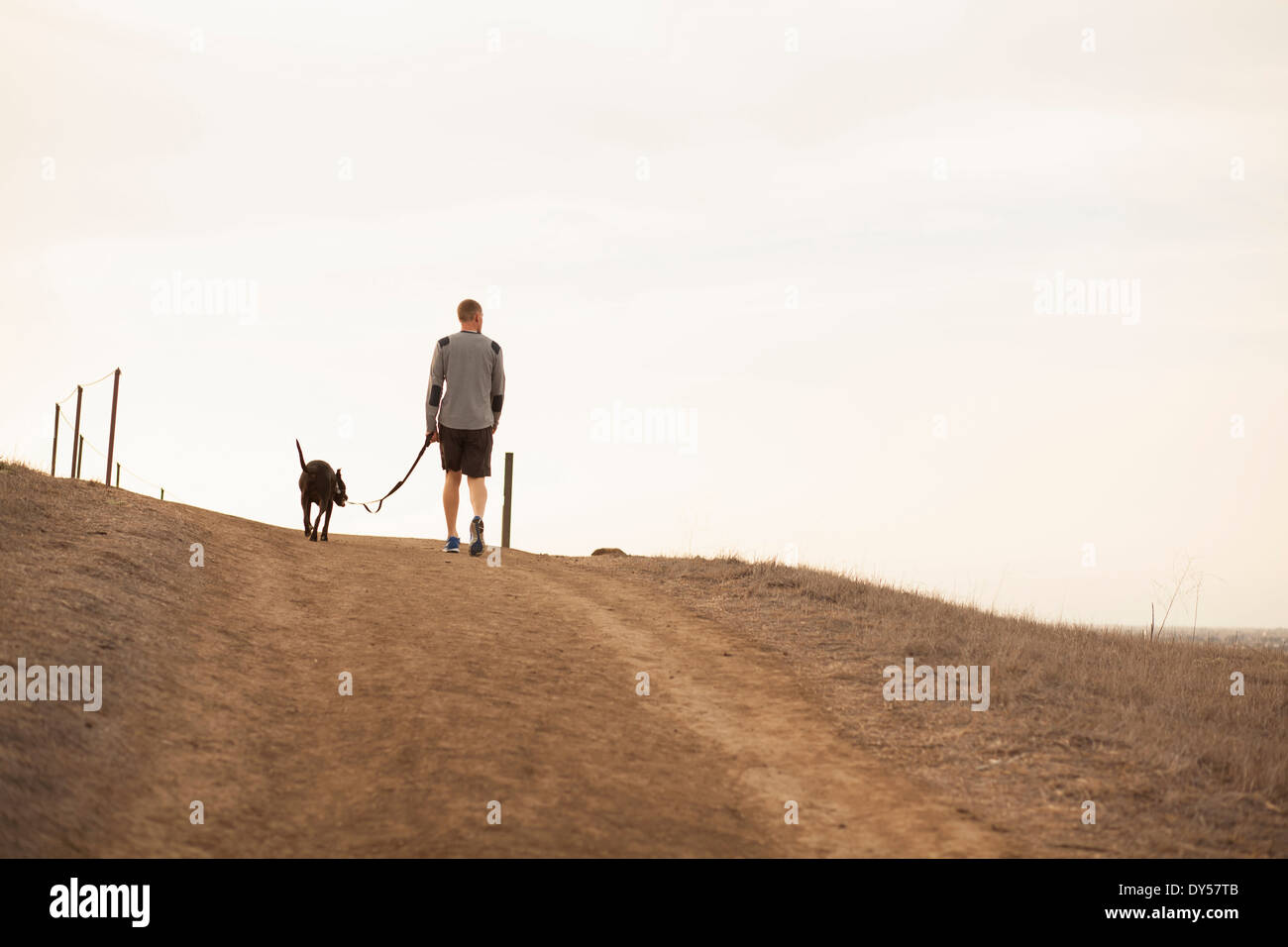 Man walking dog hi-res stock photography and images - Alamy