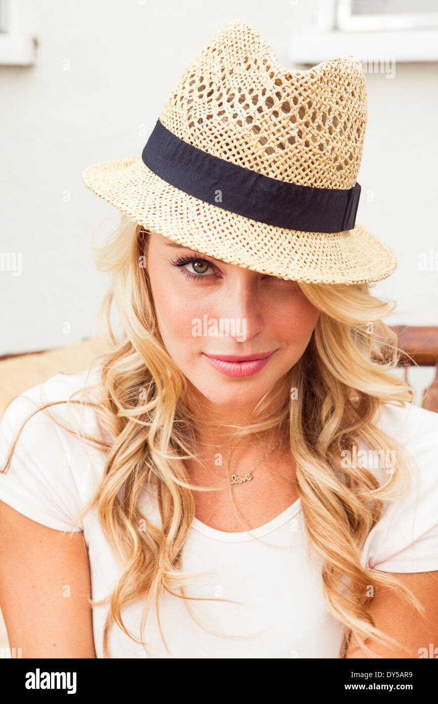 Young woman wearing straw hat Stock Photo - Alamy