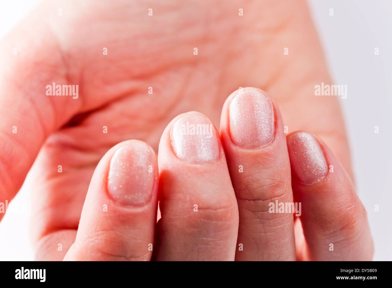 Female hand with manicure on short nails Stock Photo - Alamy
