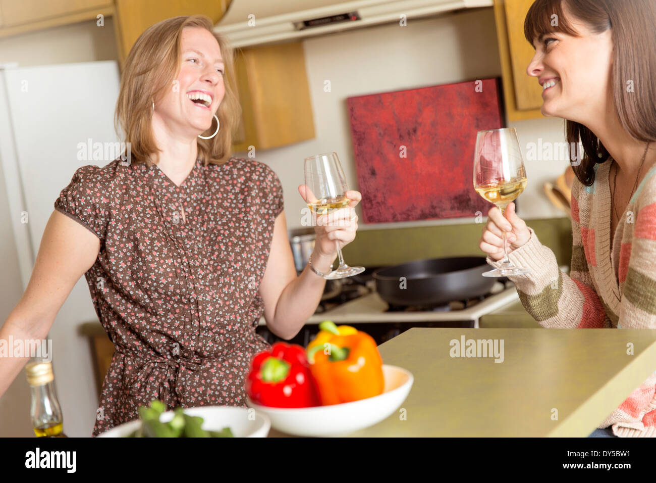 Women laughing and drinking wine hi-res stock photography and images ...