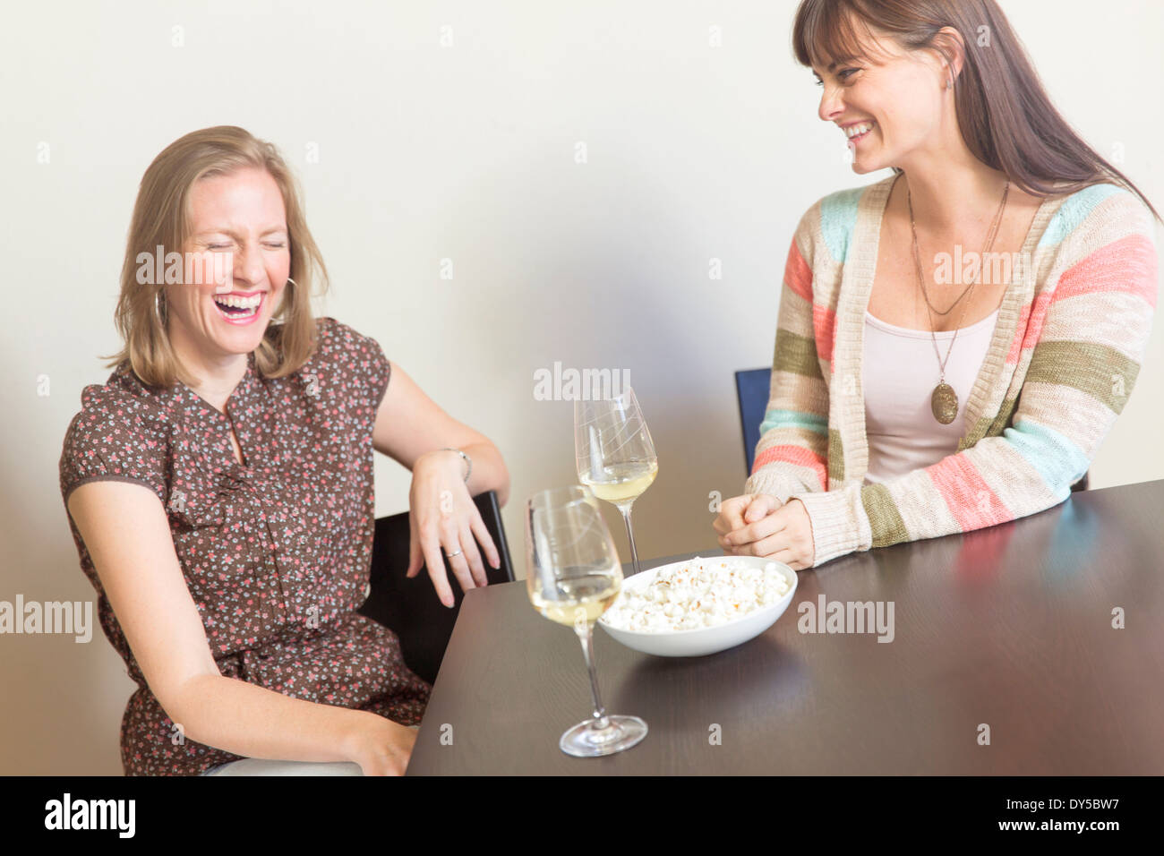 Women laughing and drinking wine hi-res stock photography and images ...