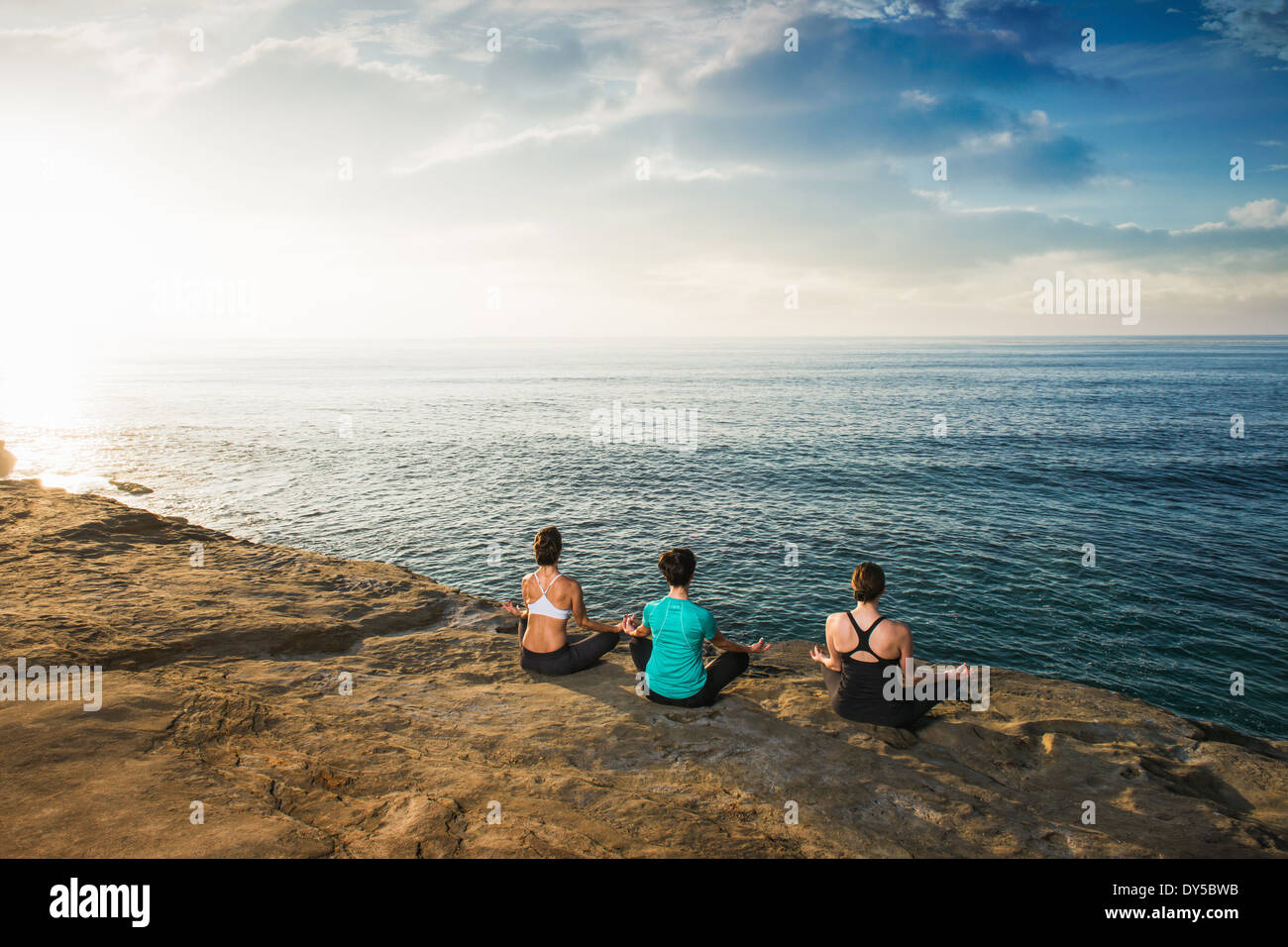 Group people sitting on cliff hi-res stock photography and images - Alamy
