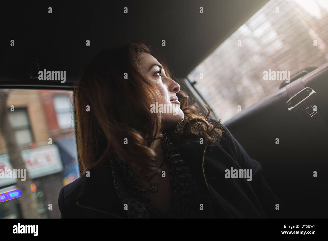Woman looking over shoulder car hi-res stock photography and images - Alamy