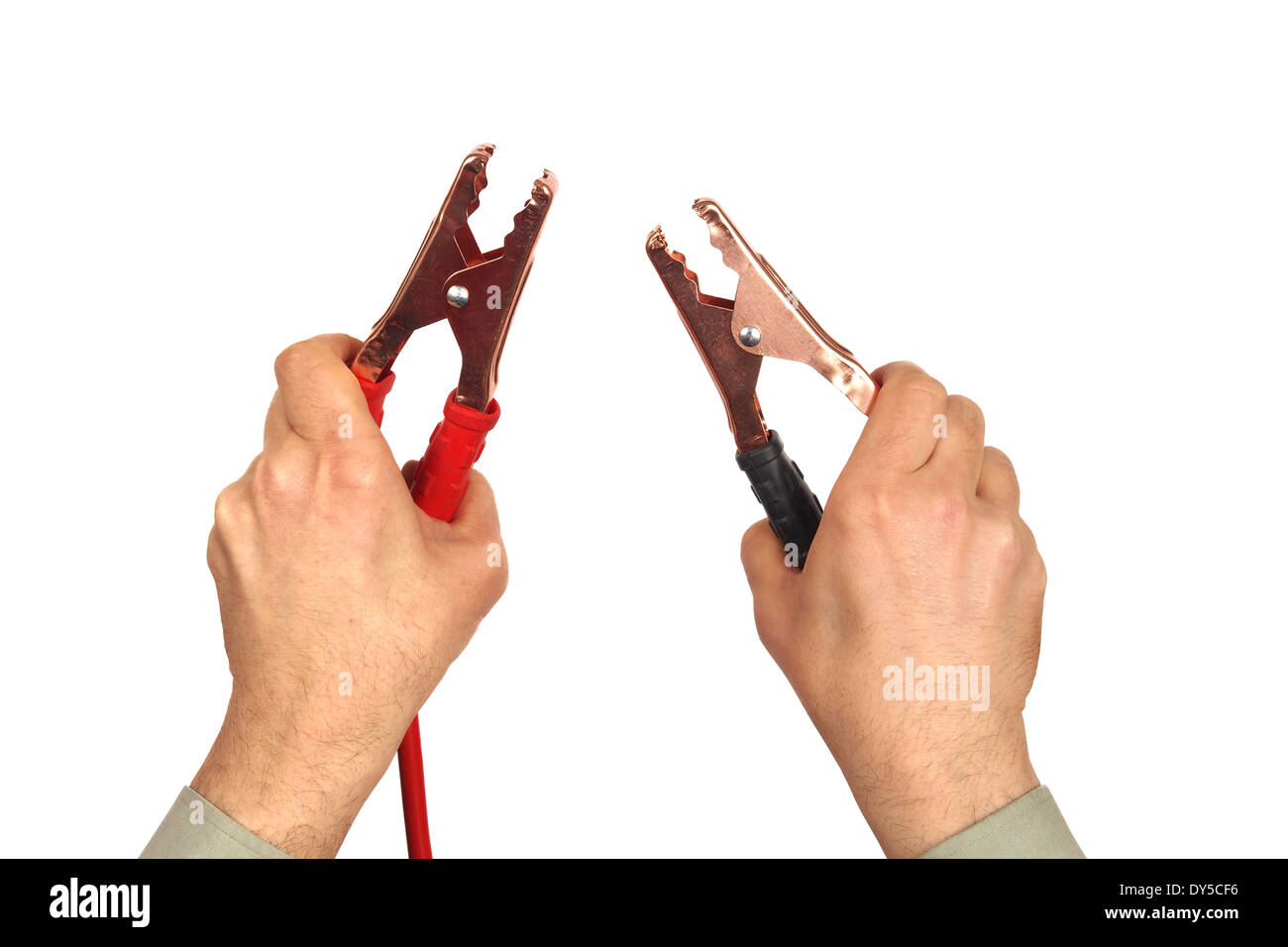 Hands with jumper cables on white Stock Photo - Alamy