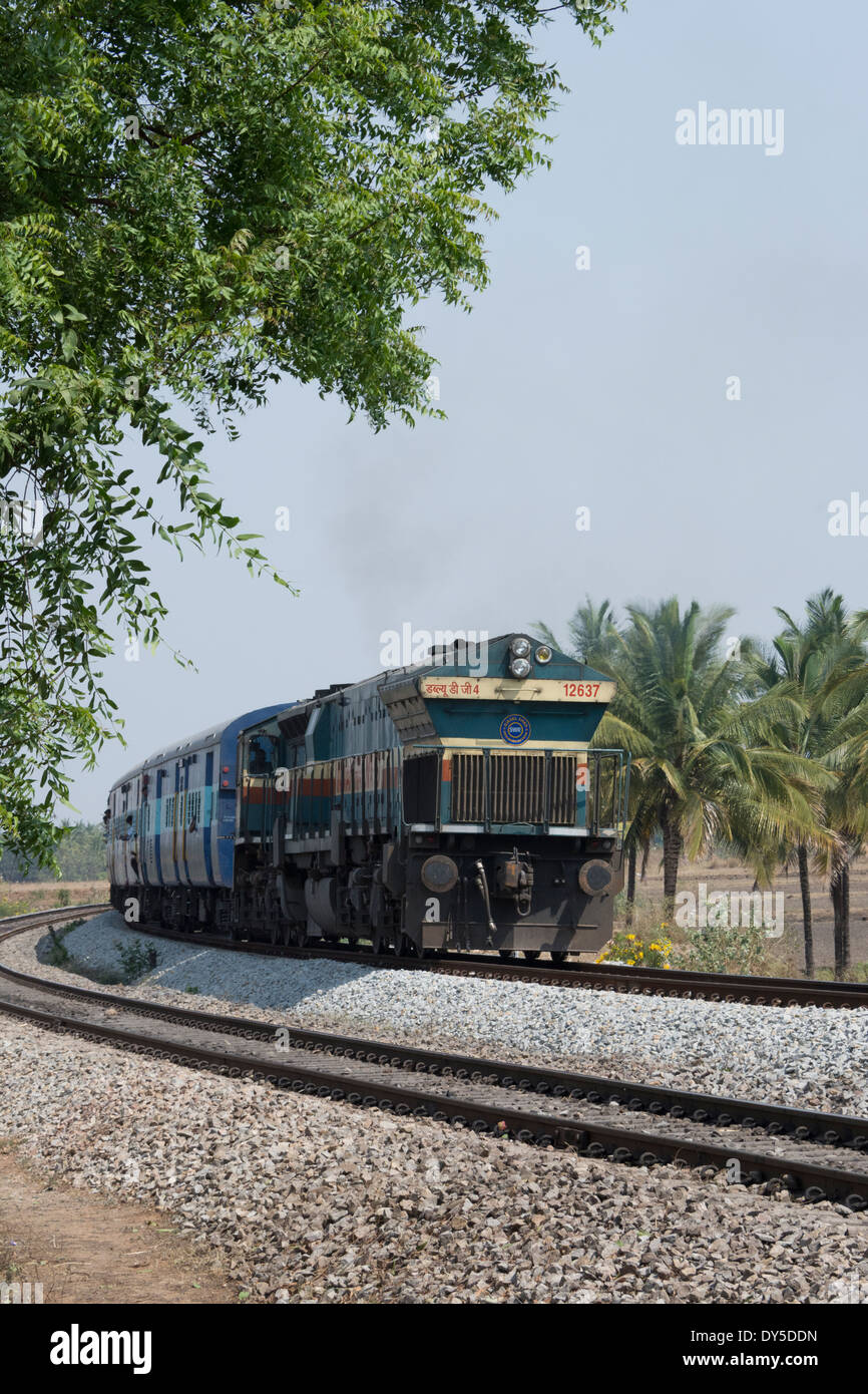 A Indian Railways diesel locomotive pulling a express train across the ...