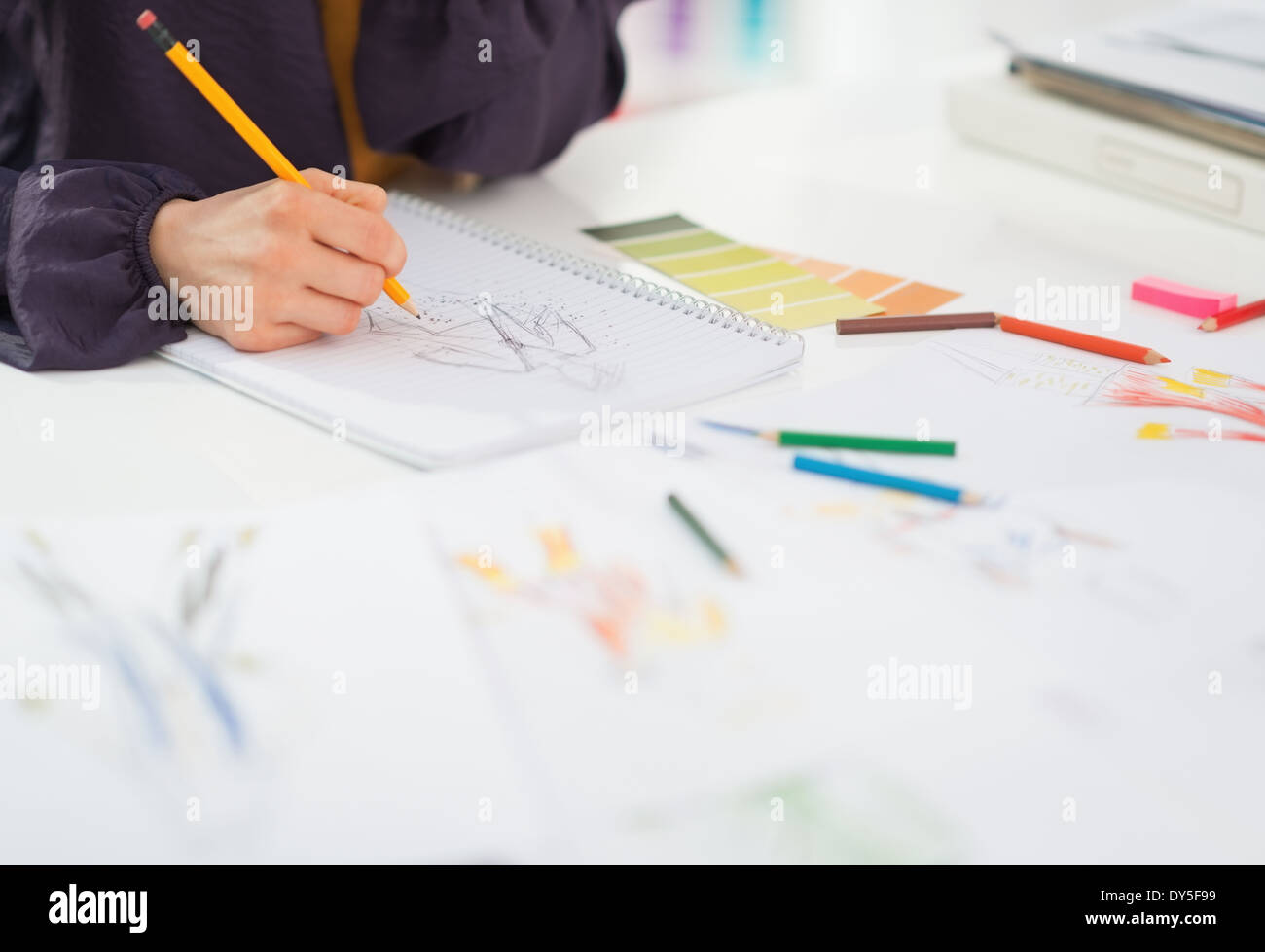 Closeup on fashion designer making sketches Stock Photo - Alamy