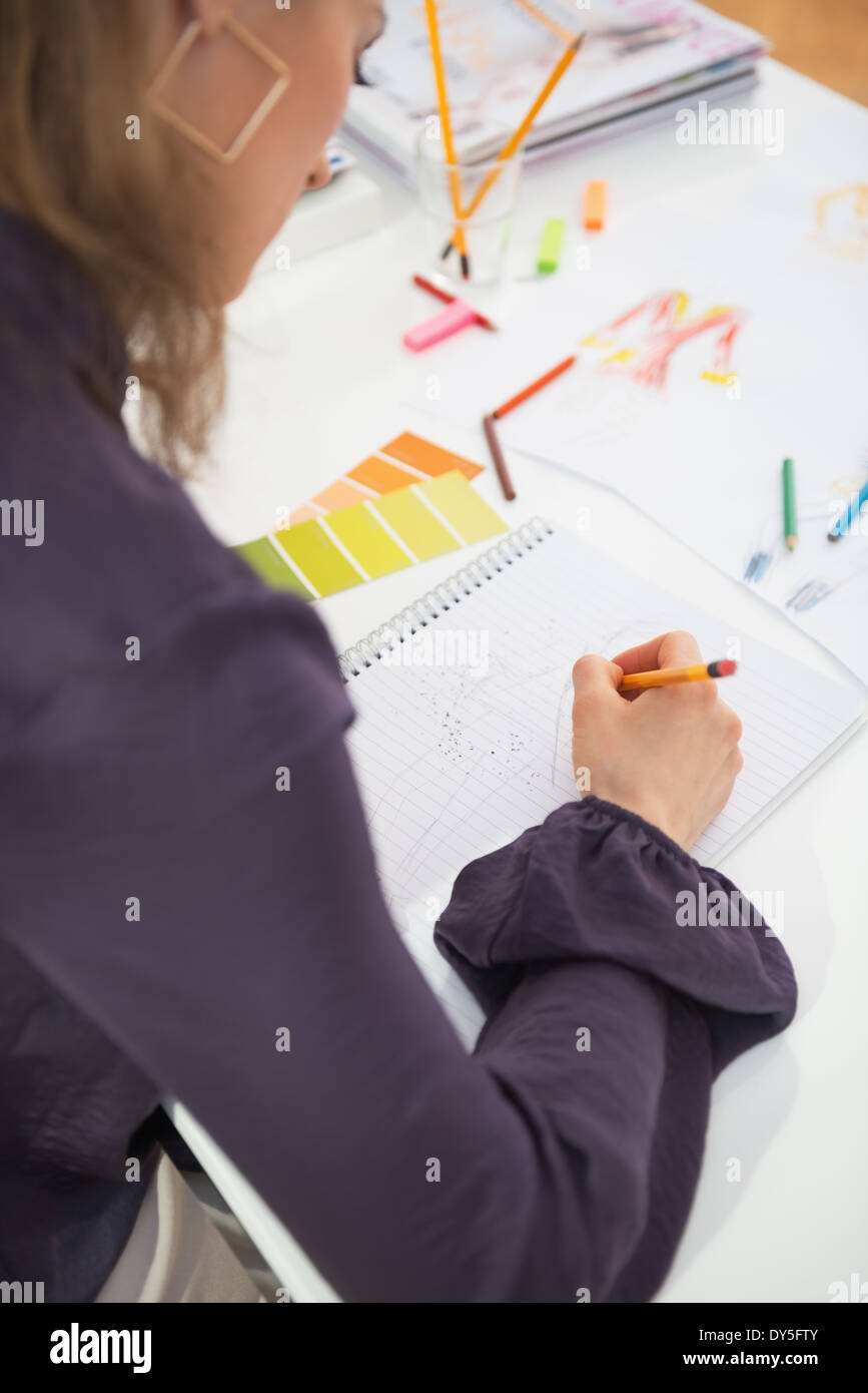 Closeup on fashion designer making sketches. rear view Stock Photo - Alamy