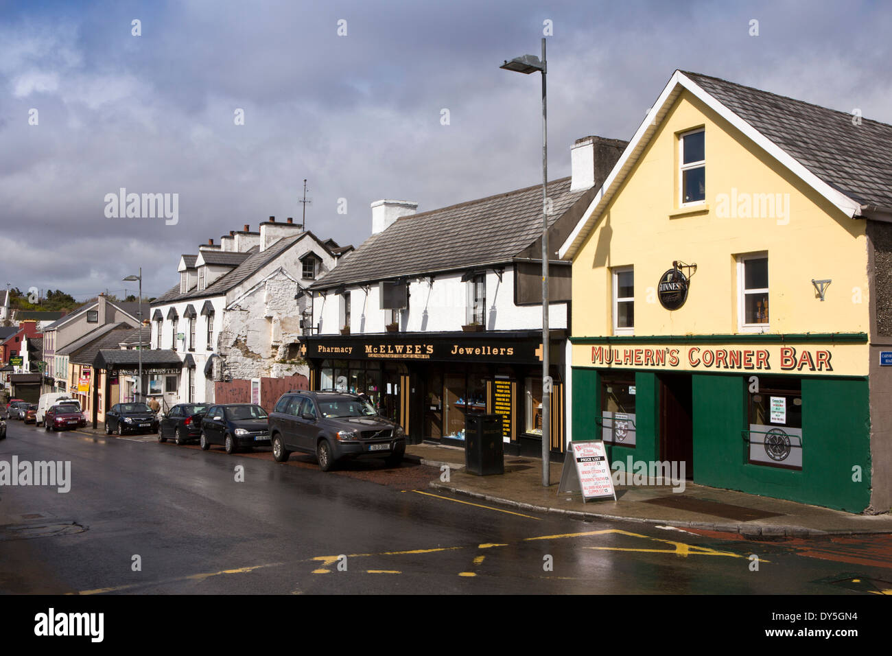 Ireland, Co Donegal, Dungloe village, shops and bars in main street ...