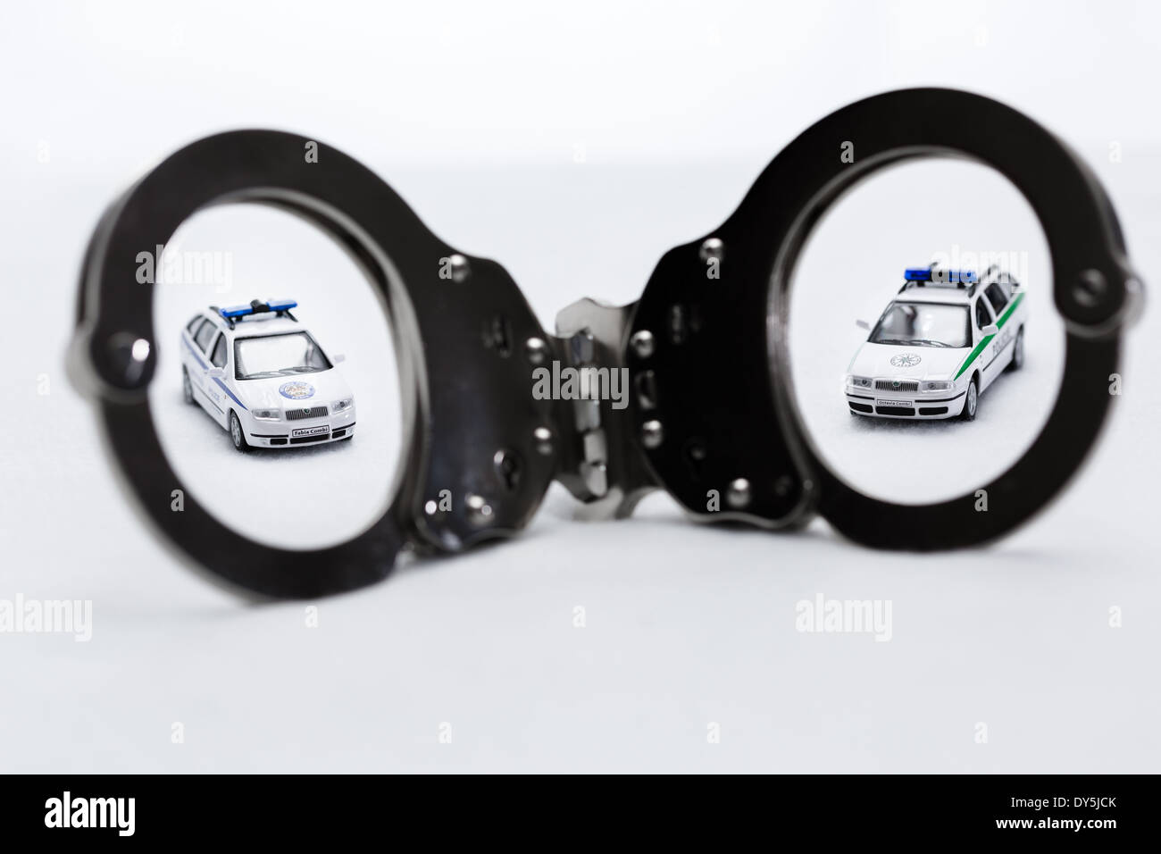 Shackles with models of police and city police car on white background ...