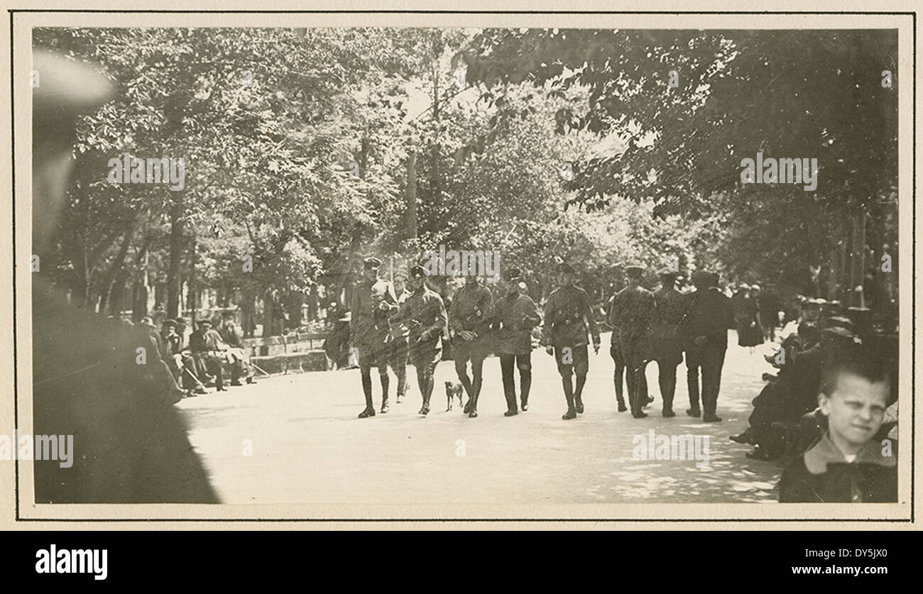 A scene of army officers leading a regiment of soldiers and crowds ...