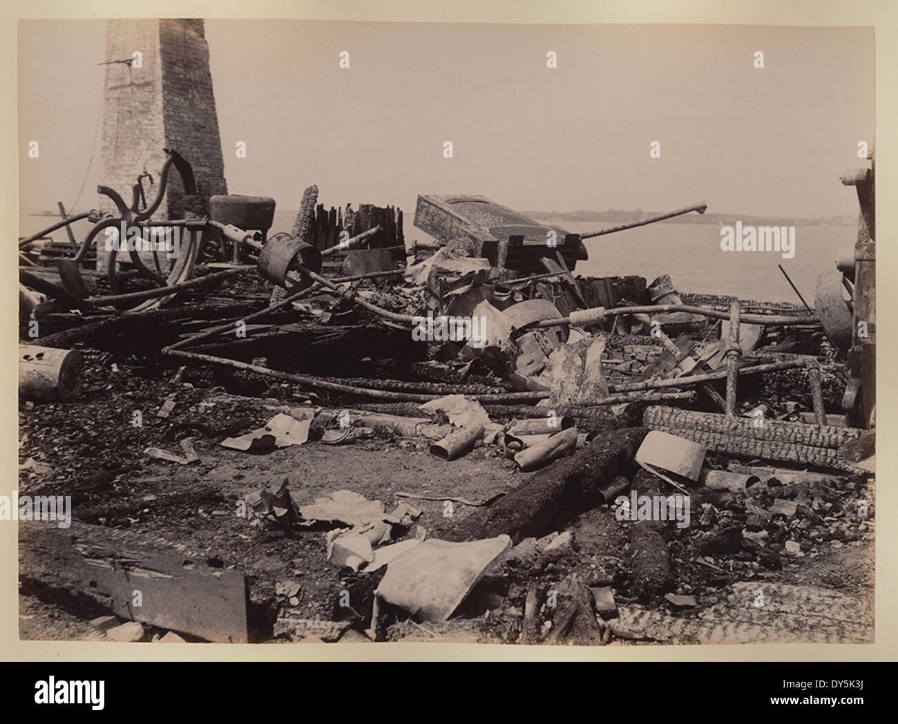 The image shows the aftermath of an explosion in a U.S. Navy ordnance ...